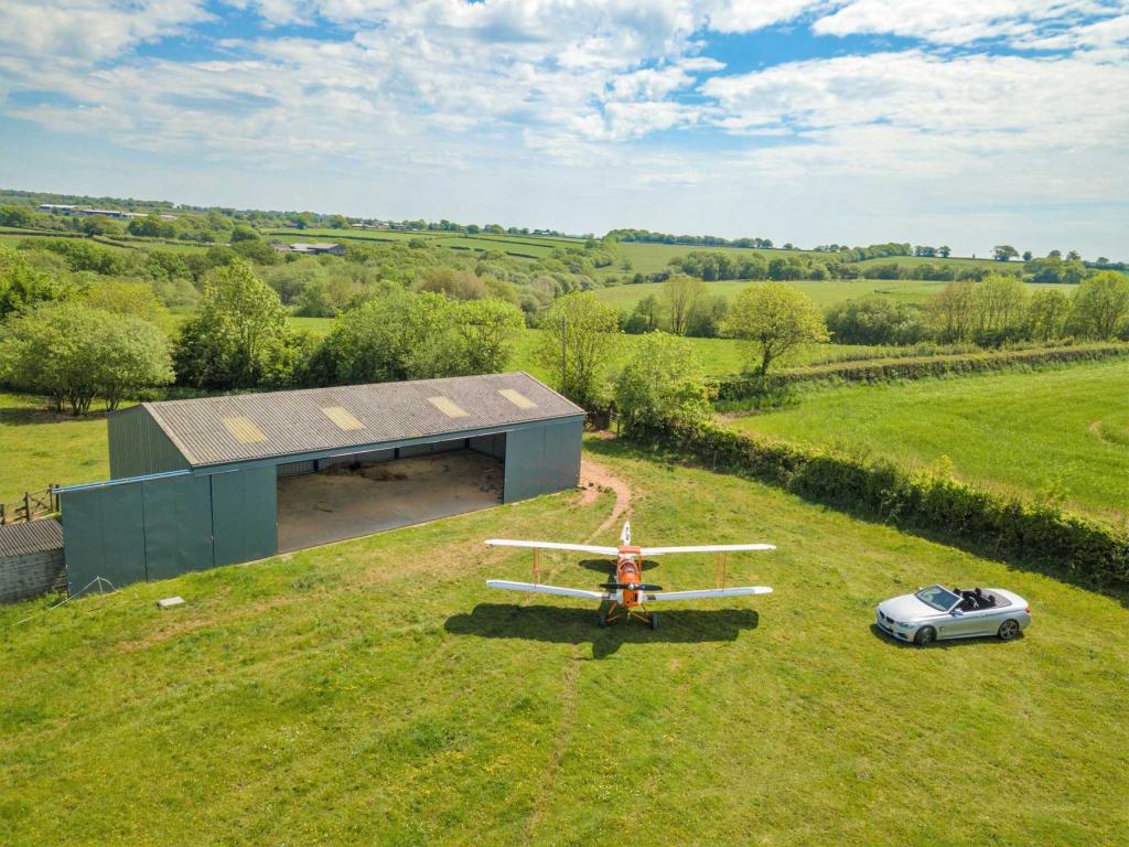 Discover the Devon farmhouse with an aircraft runway