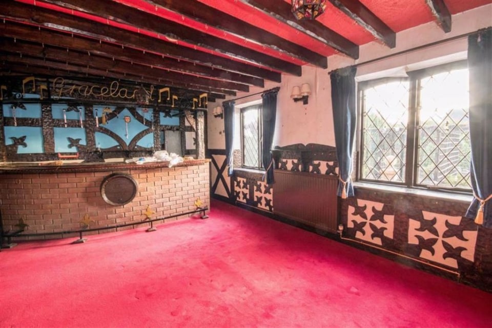 Peek inside the modern day castle with its own mini moat